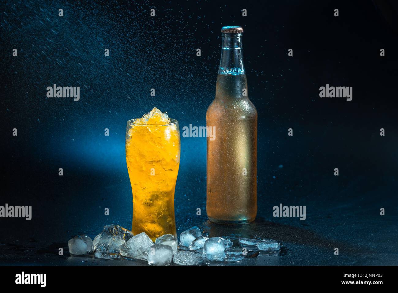 Beer slushies cocktail. Beer on the rocks with a splash of water. A ...