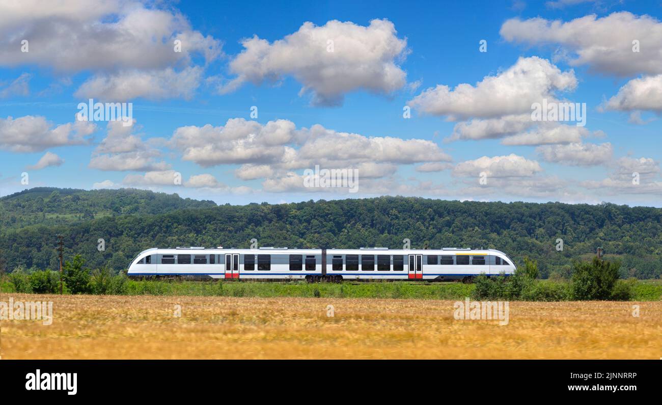 A modern high-speed train rides on a summer day, with copy space Stock ...