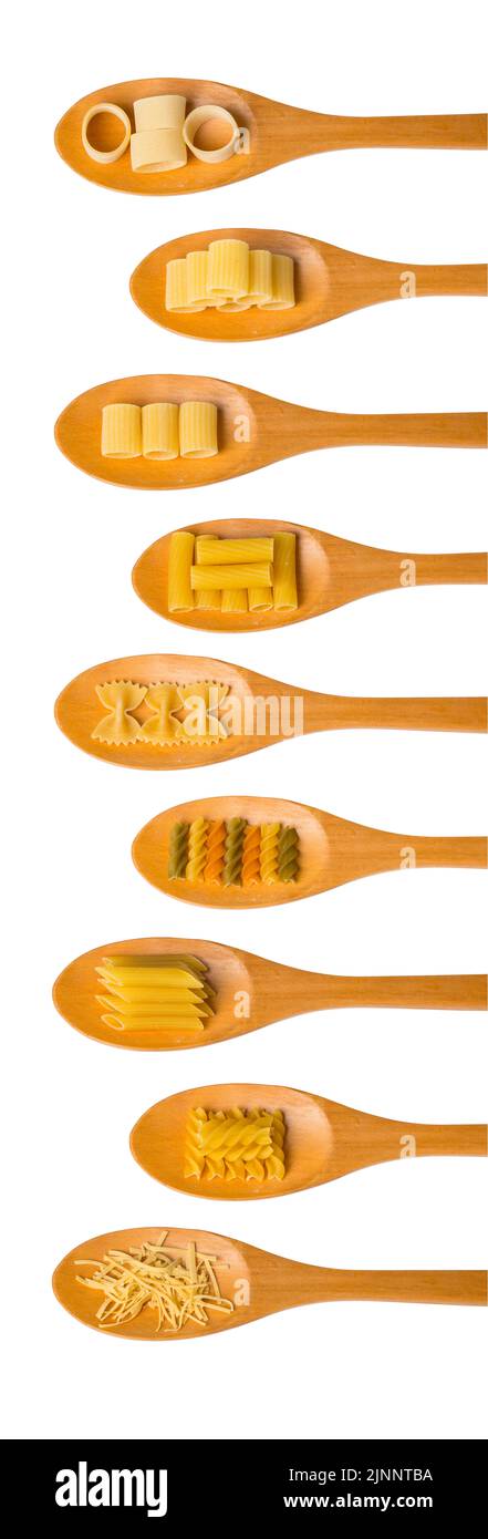 Wooden cooking spoons filled with various types dry pasta isolated on a ...