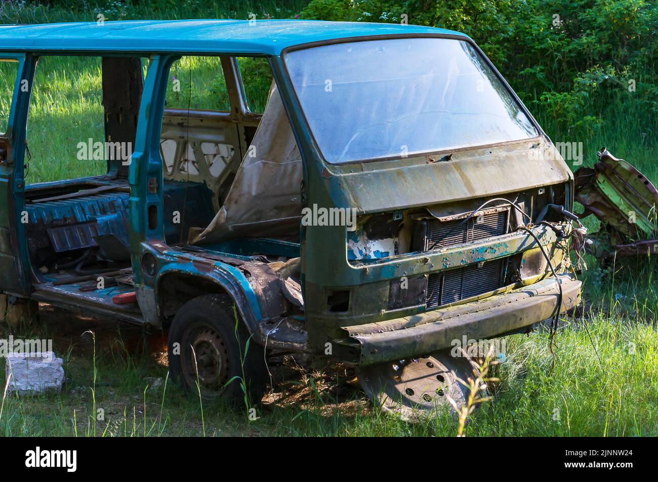 Old, damaged car. Abandoned car in the woods.Defective car. A car unfit ...