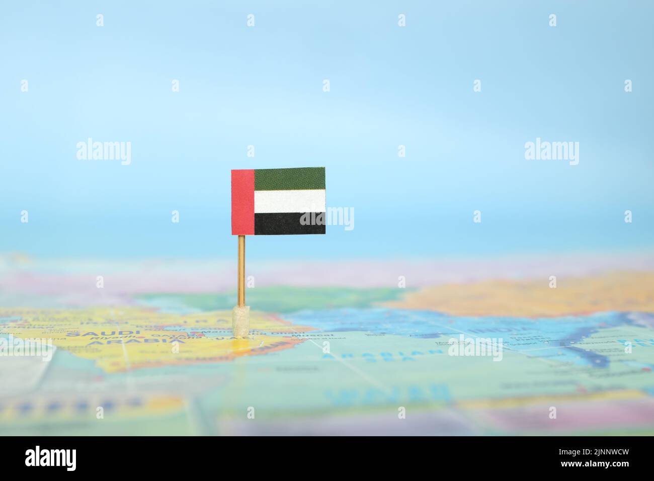 Selective focus of UAE flag in world map. UAE country location and ...