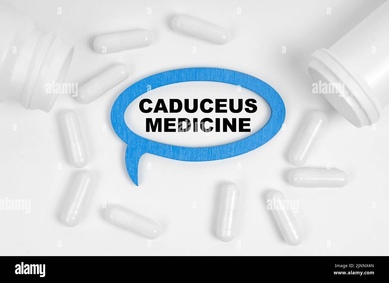 Medicine concept. On the table there are pills and a blue plaque inside ...