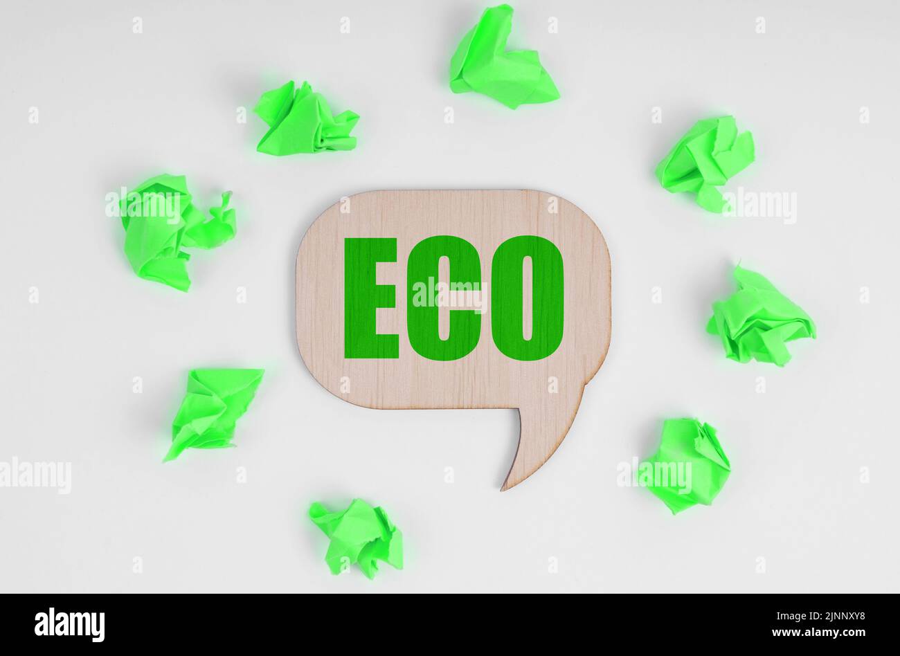 Ecology concept. On a white background, there are crumpled green pieces ...