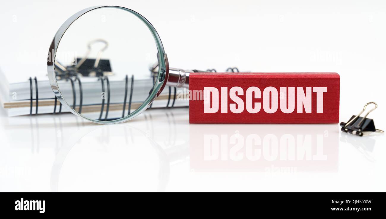 Business concept. On the table is a notebook, a magnifying glass and a ...