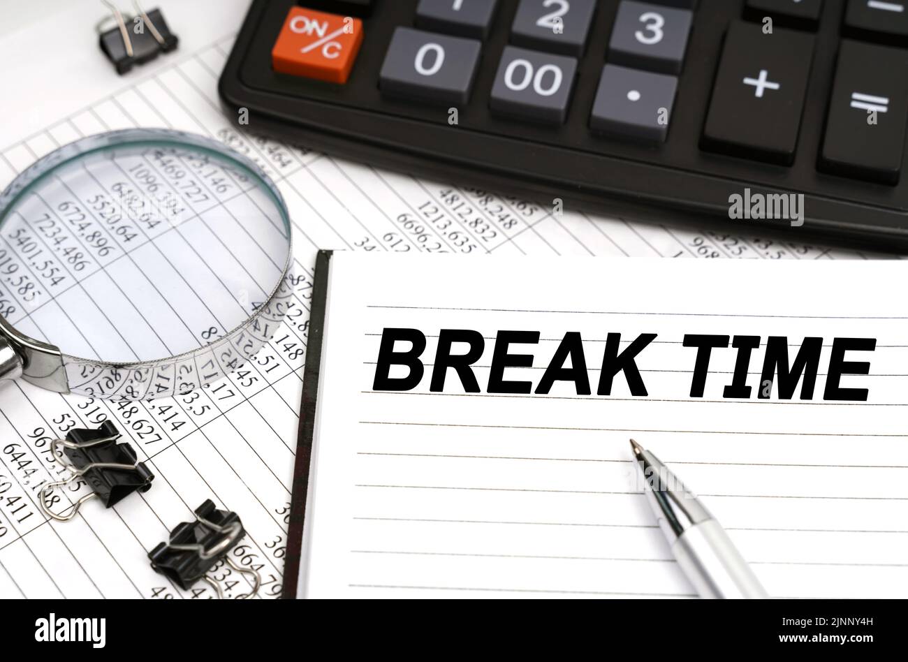 Business concept. On the table is a magnifying glass, a calculator, a ...