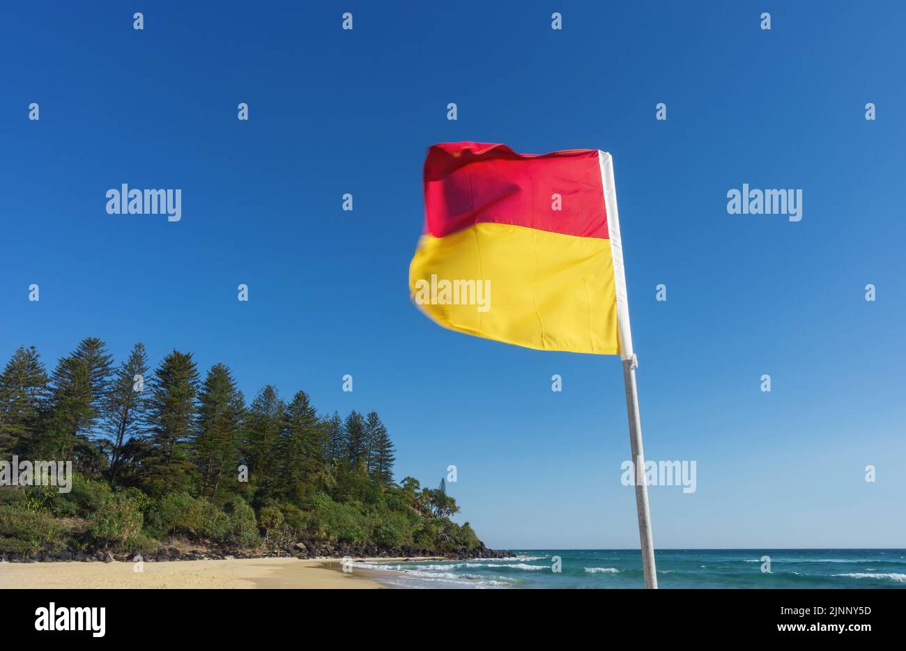 Beach swimming flag fluttering in the wind Stock Photo - Alamy