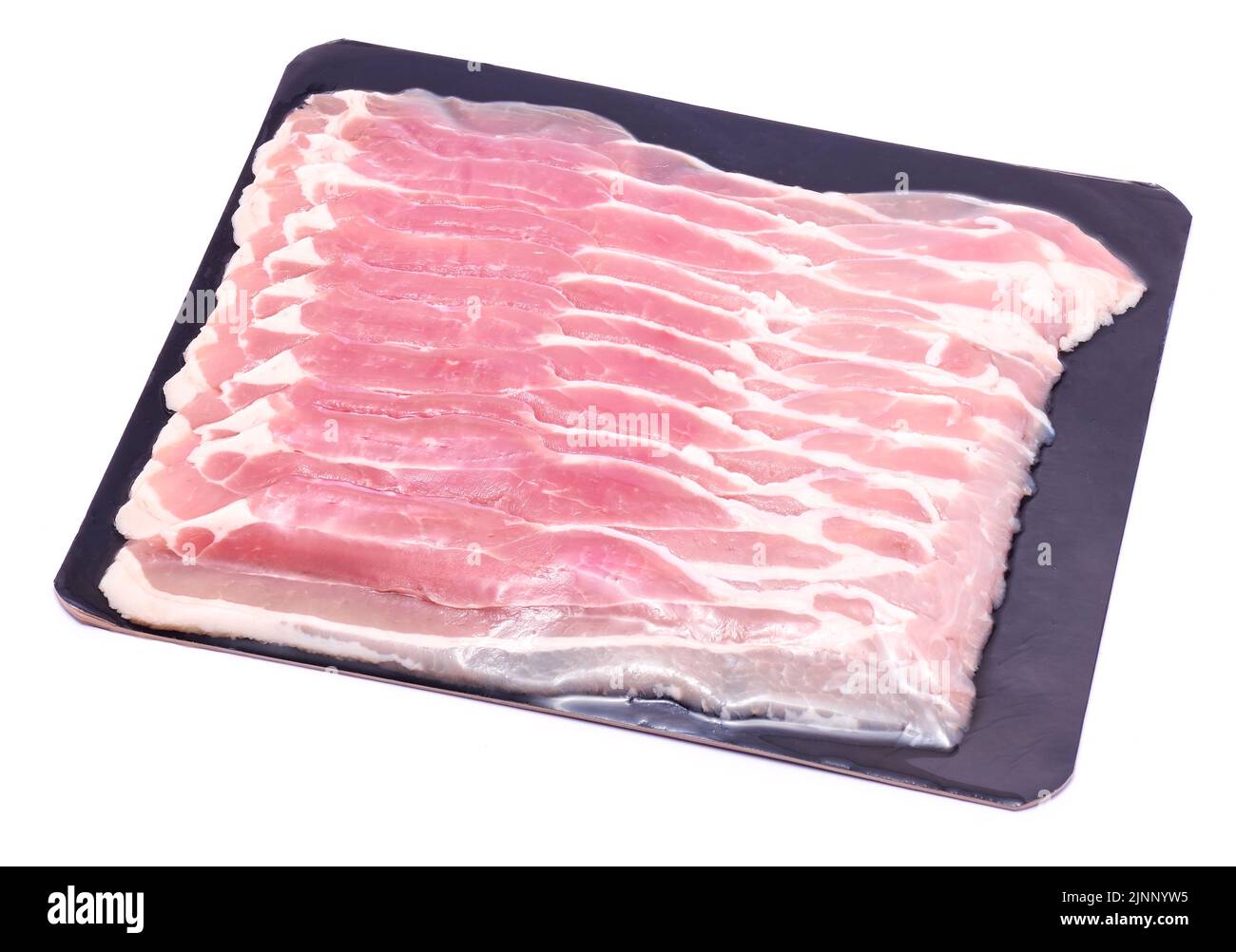 Bacon strips on black package paper for wholesales isolated on white ...