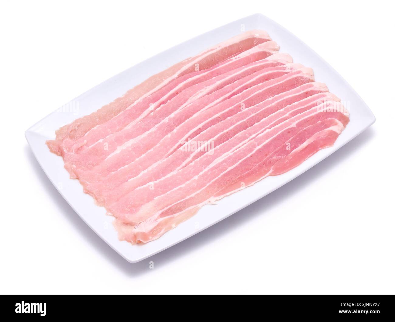 Bacon strips on ceramic plate isolated on white background Stock Photo ...