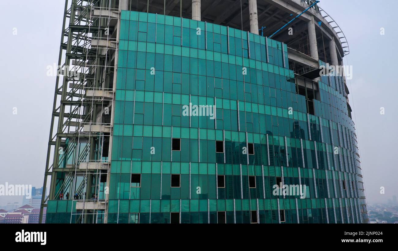 Construction of high-rise skyscrapers with many floors using cranes ...