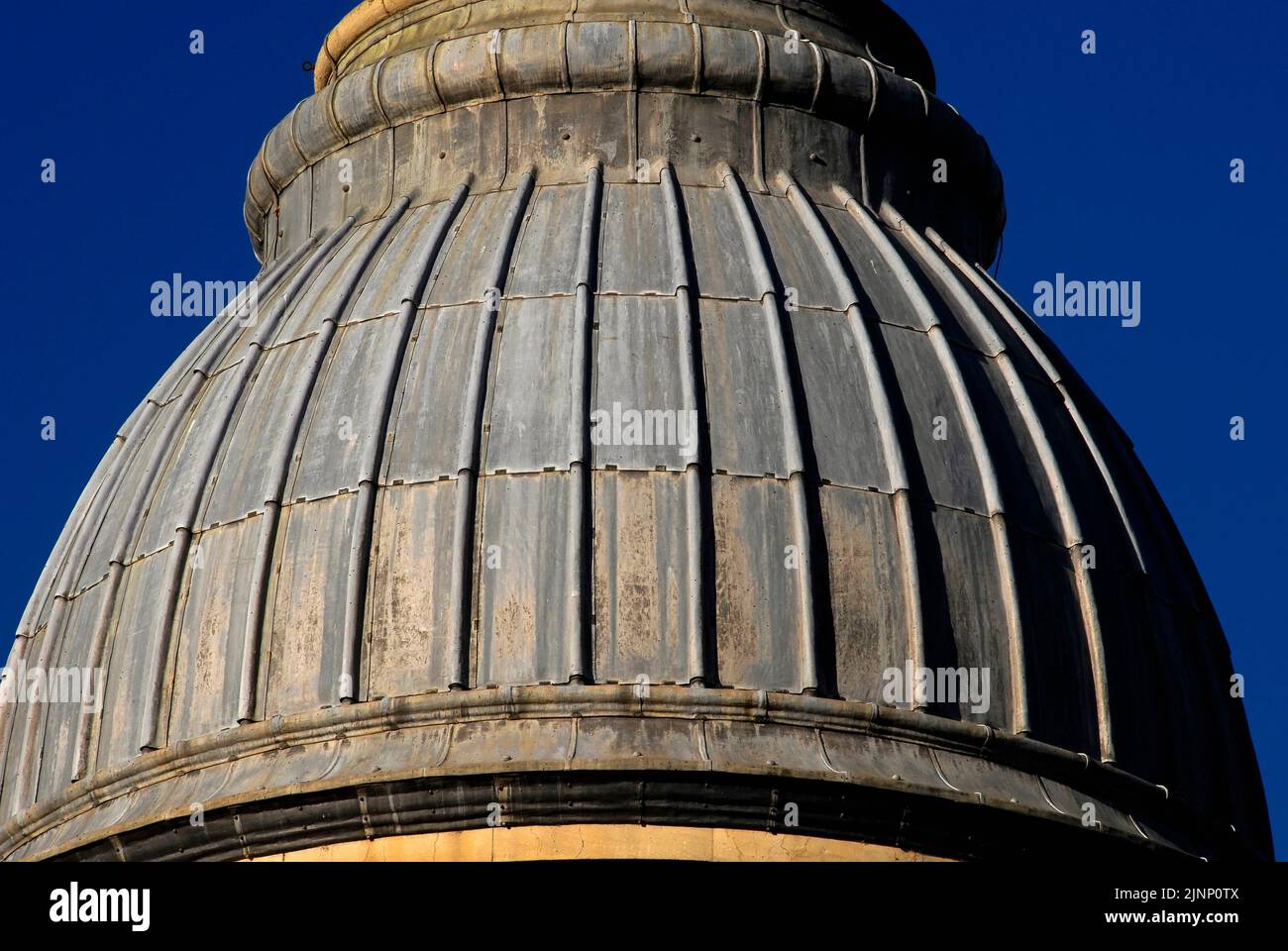 This ribbed, lead-covered dome tops the round clock tower of the former ...