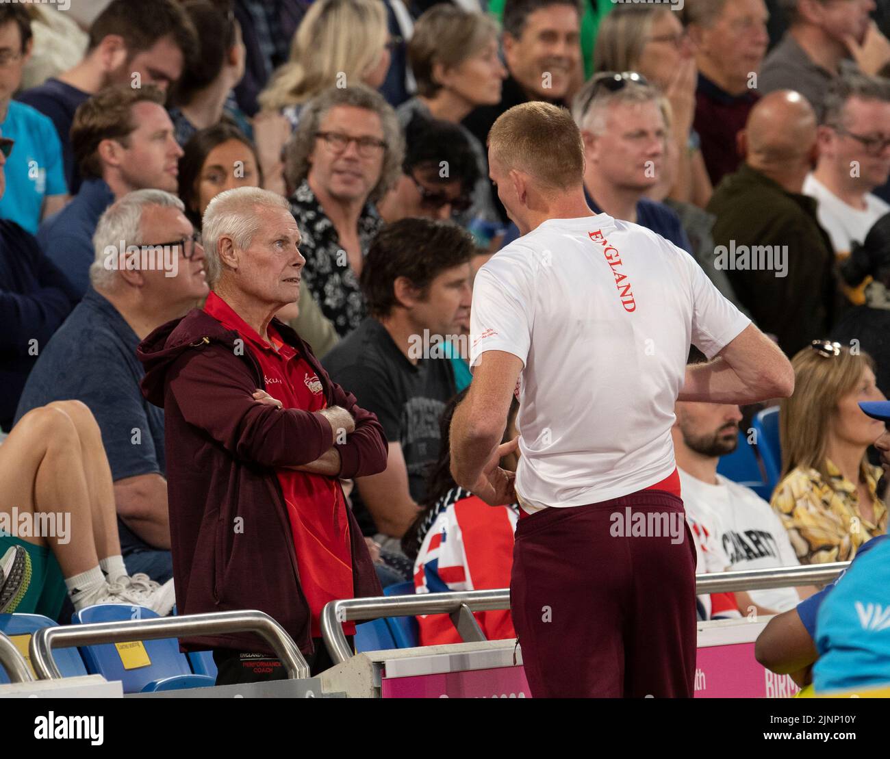 Adam Hague of England talking to his coach Trevor Fox while competing ...