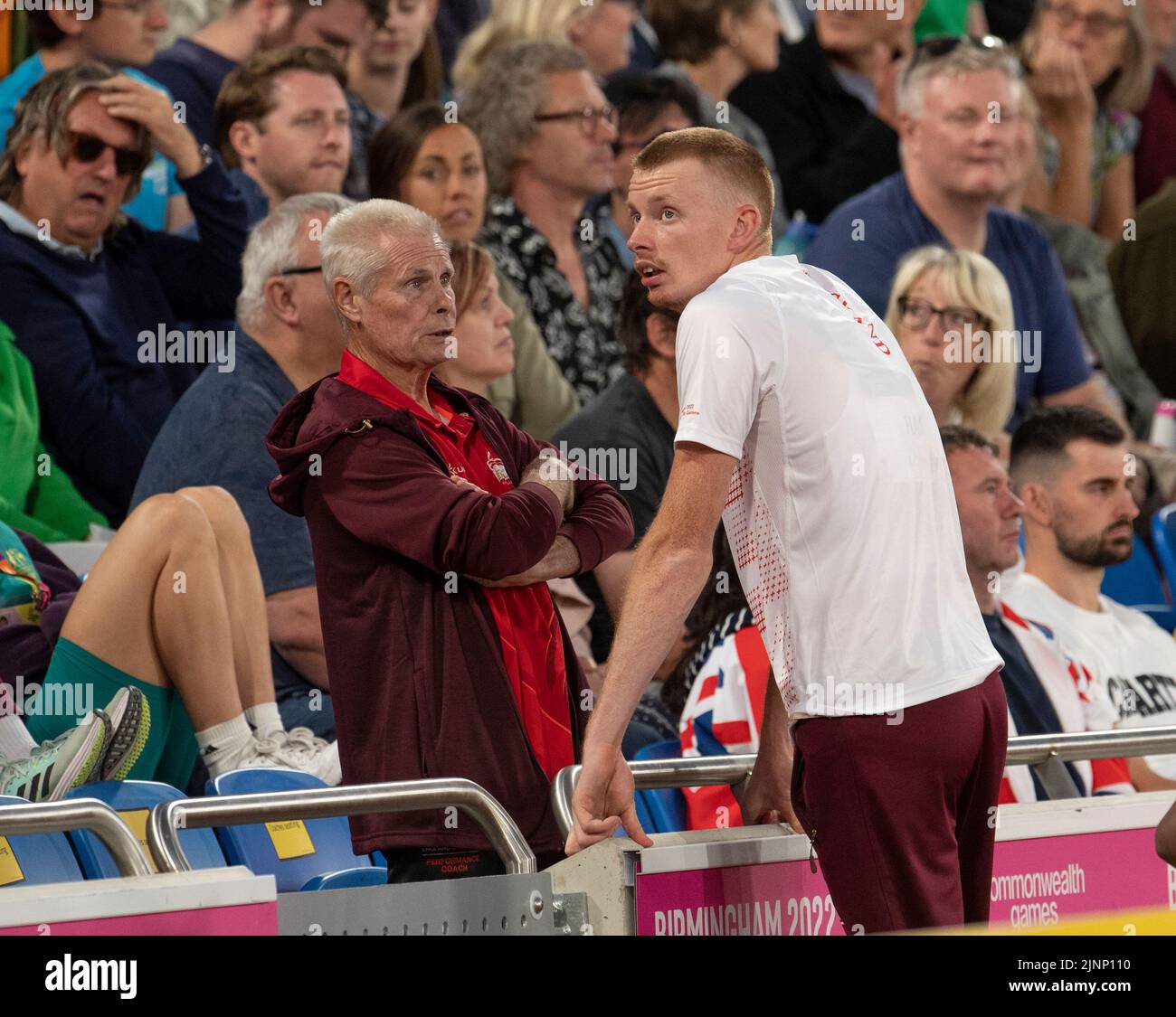 Adam Hague of England talking to his coach Trevor Fox while competing ...