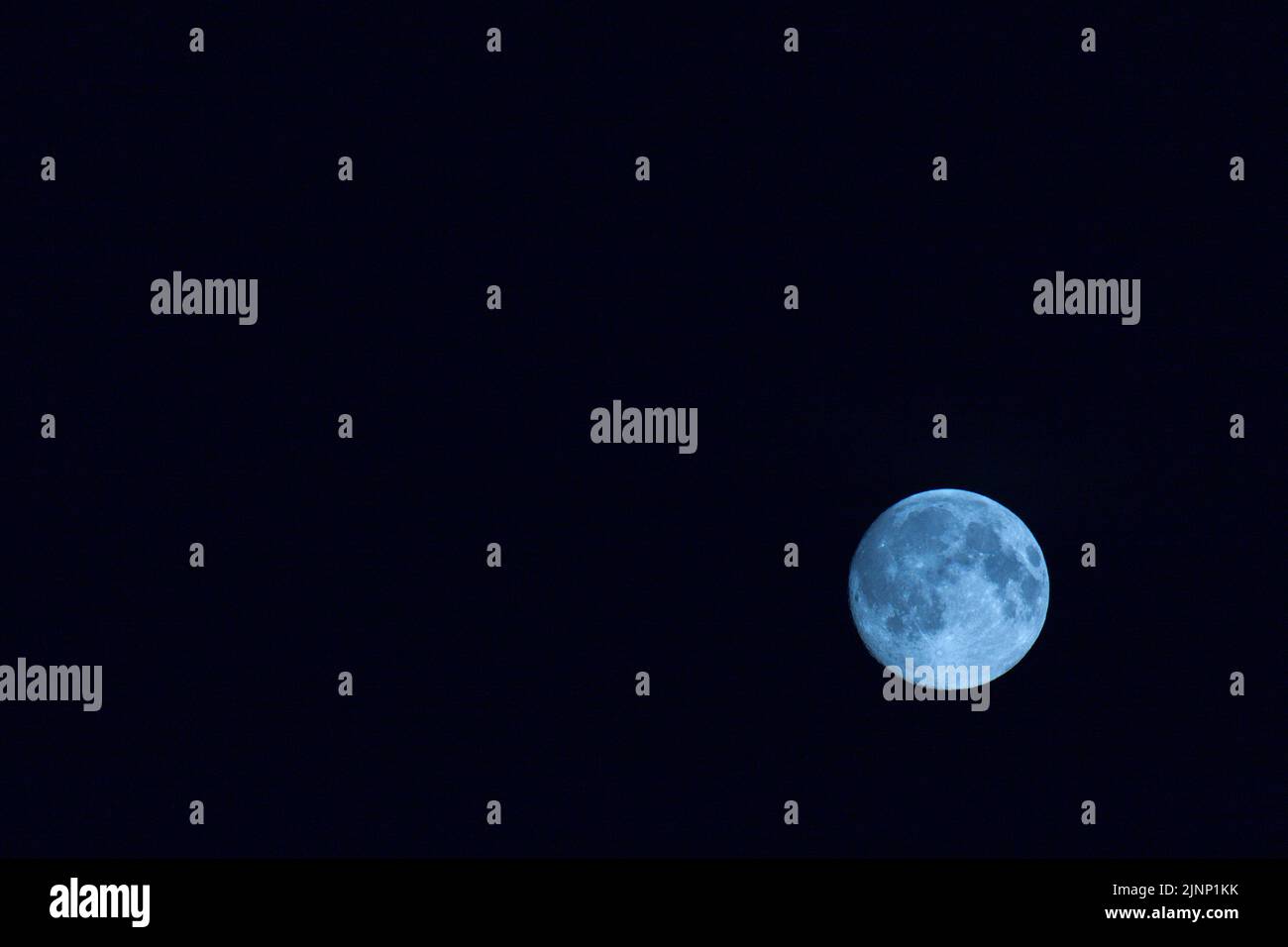Blue moon, Lunar in the night. Black night Stock Photo - Alamy