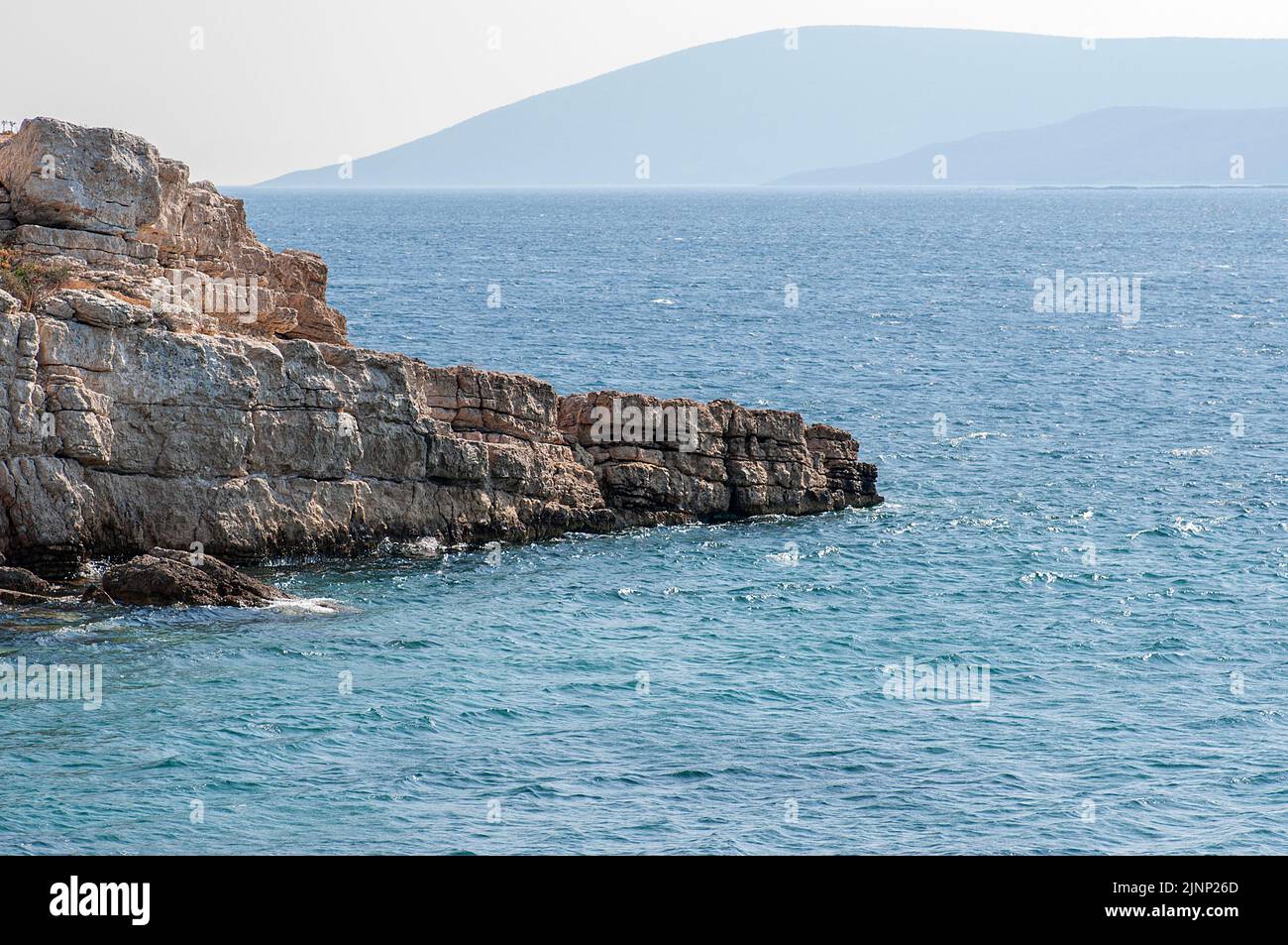 The rocky outcropping into the sea has created a beautiful landscape ...