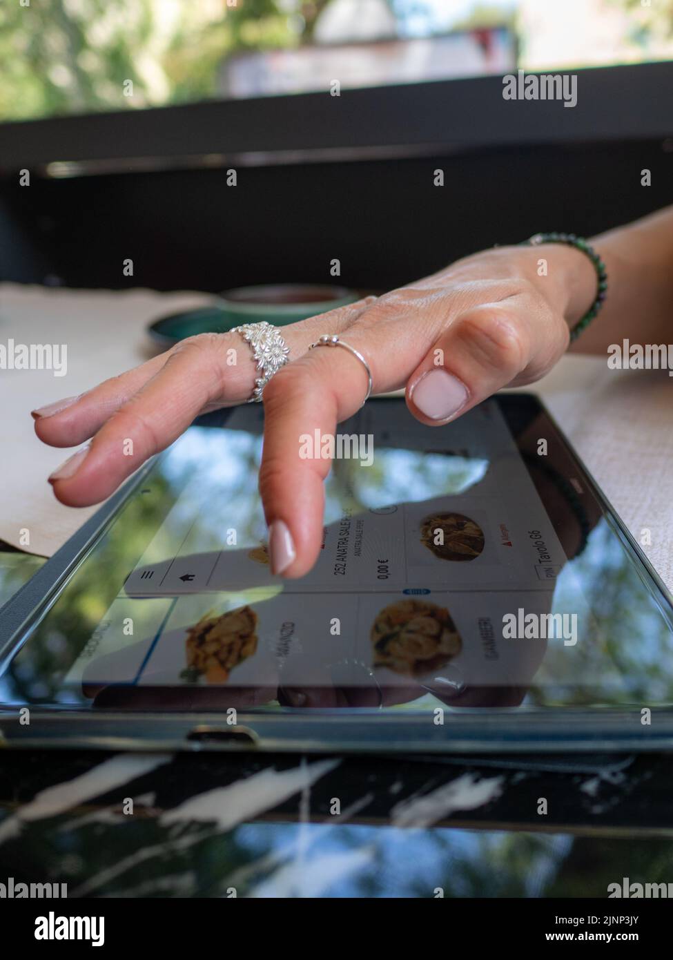 female customer ordering food at restaurant Stock Photo - Alamy