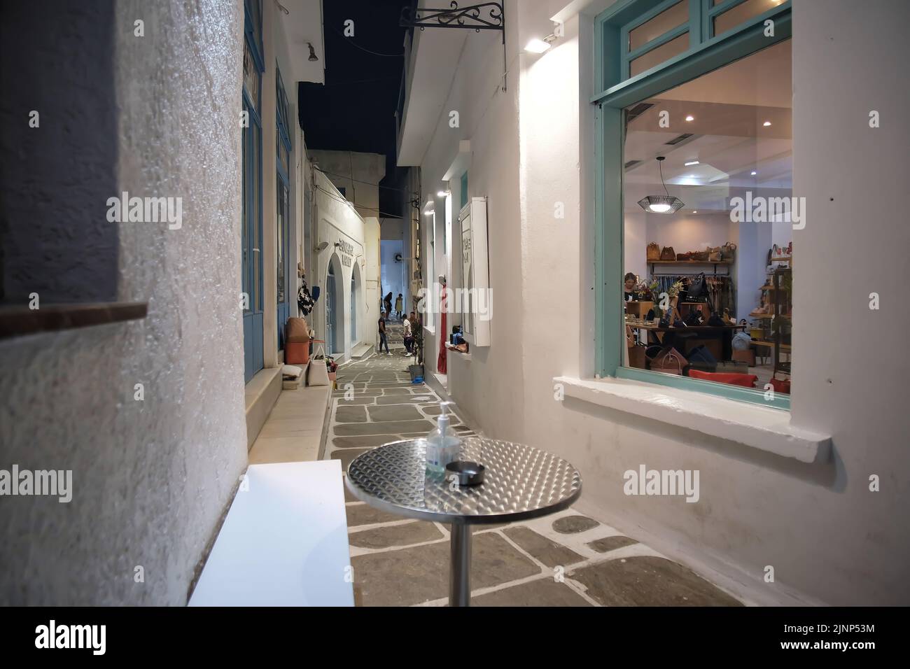 Ios, Greece - June 8, 2021 : View of a typical alley with bars and ...