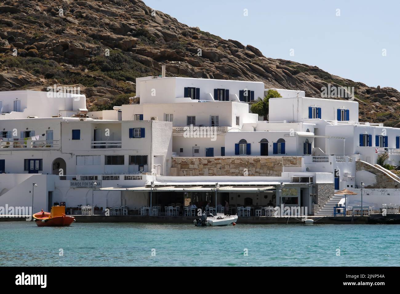 Ios, Greece - June 8, 2021 : View of a whitewashed hotel and a seafood ...