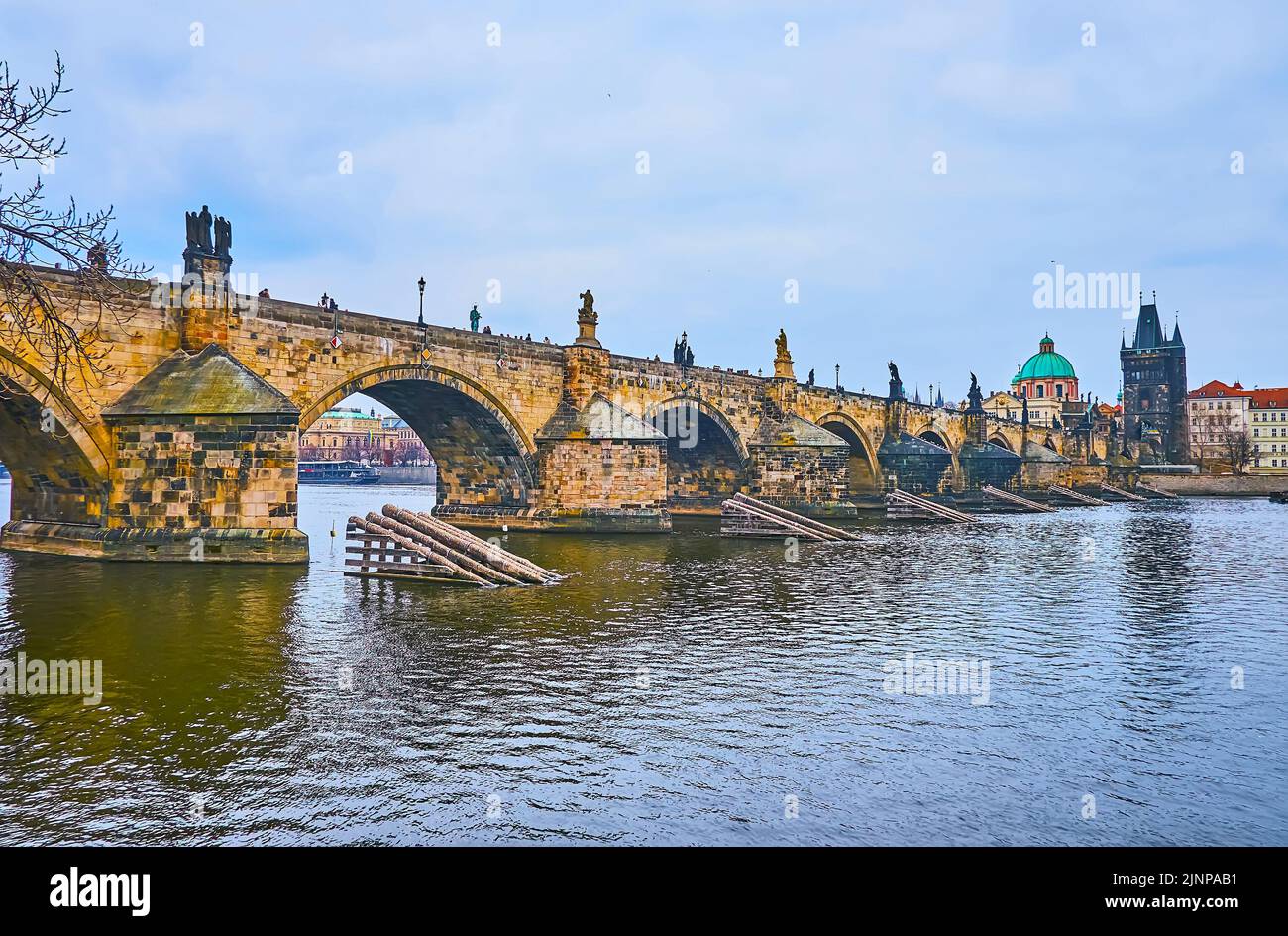 The medieval arched Charles Bridge (KArluv Most) with carved statues ...