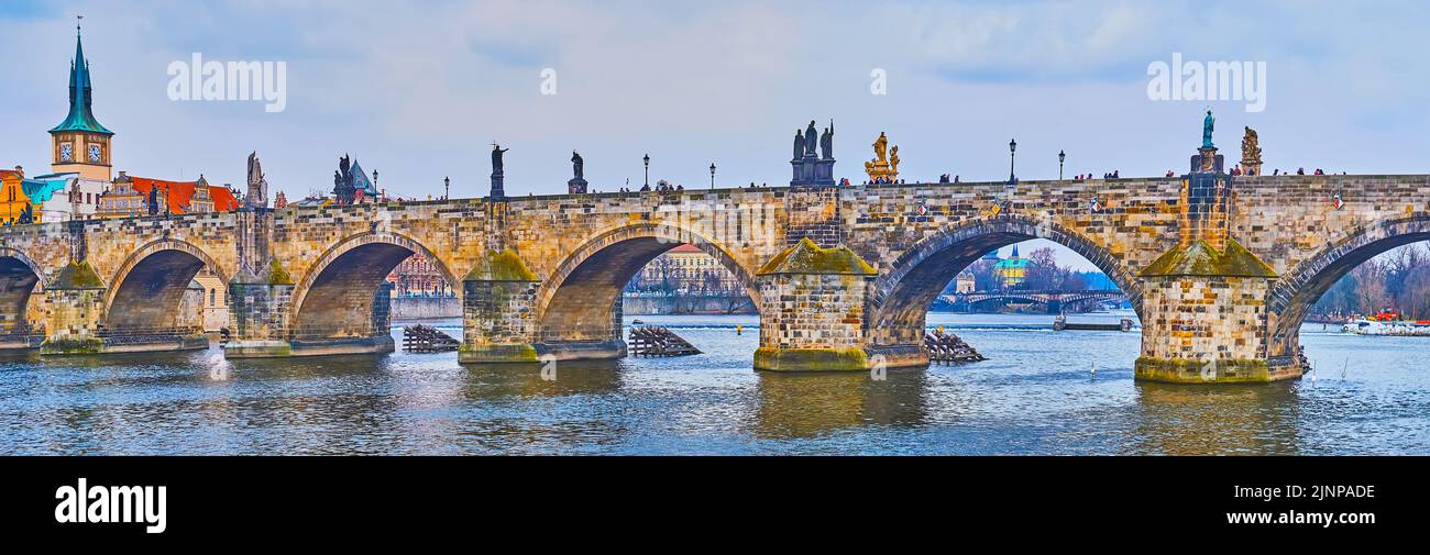 Panorama with stone arches of the Charles Bridge, decorated with ...