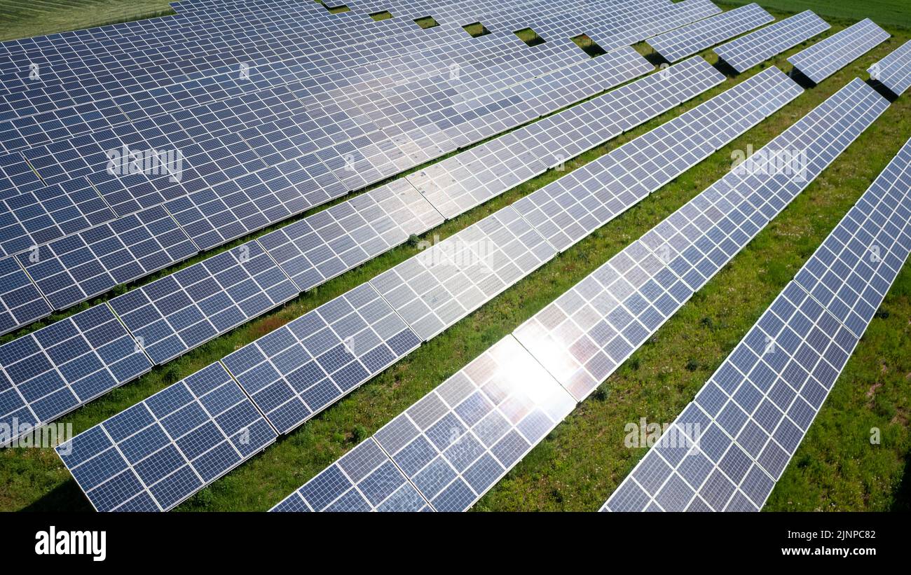 Big and blue solar panels as a renewable energy source. Pure energy in ...