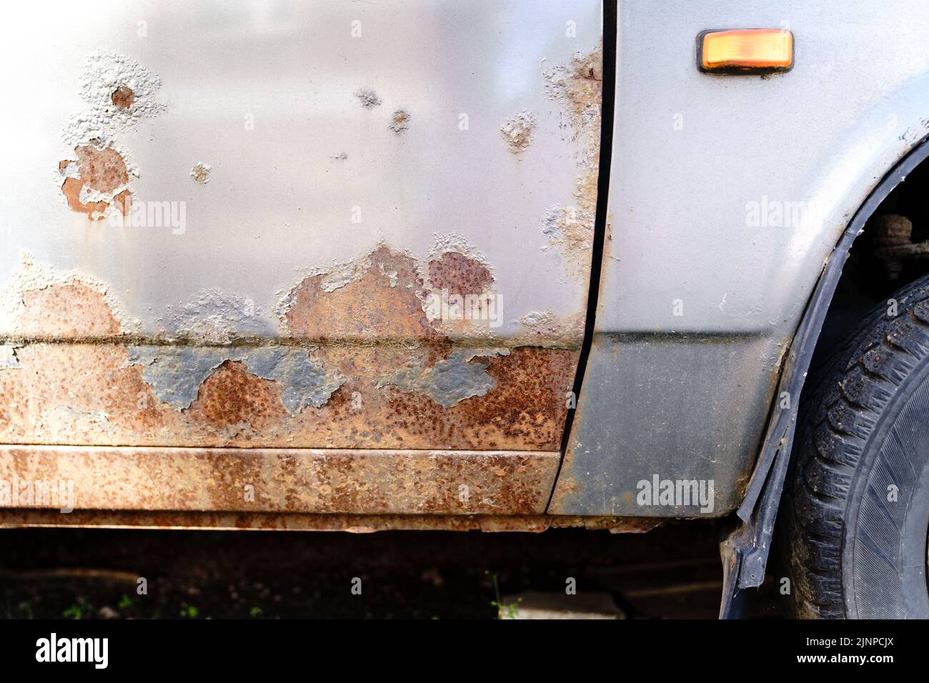 Damaged grunge dirty texture from road salt. Sheet metal corrosion of old silver car door Stock ...