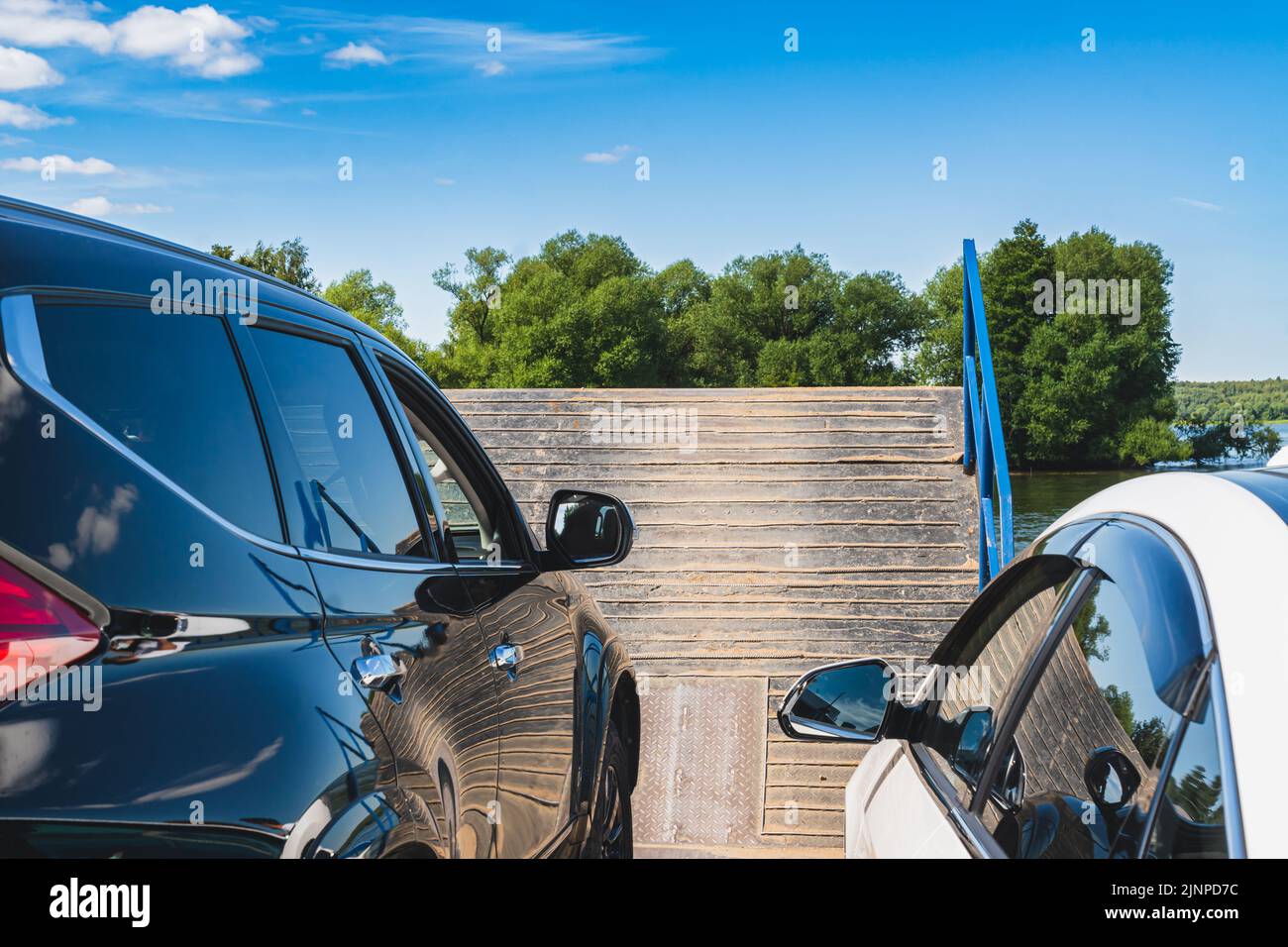 Boarding cars on a ferry crossing Volga rive in Konakovo, Russia Stock ...