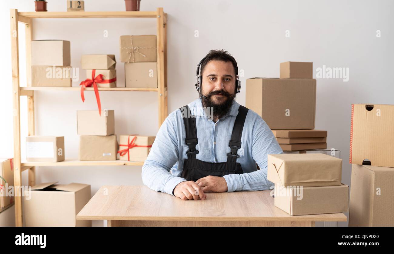 Start up. young man small business owner working at home office using ...