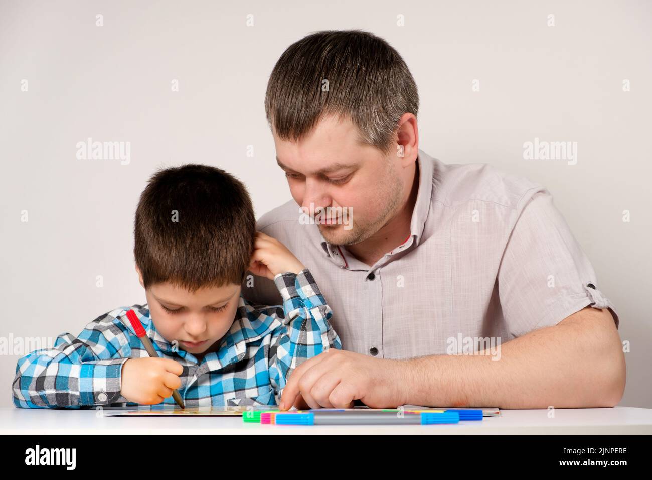 Father and son go through labyrinths, perform tasks for logic and the development of thinking in ...