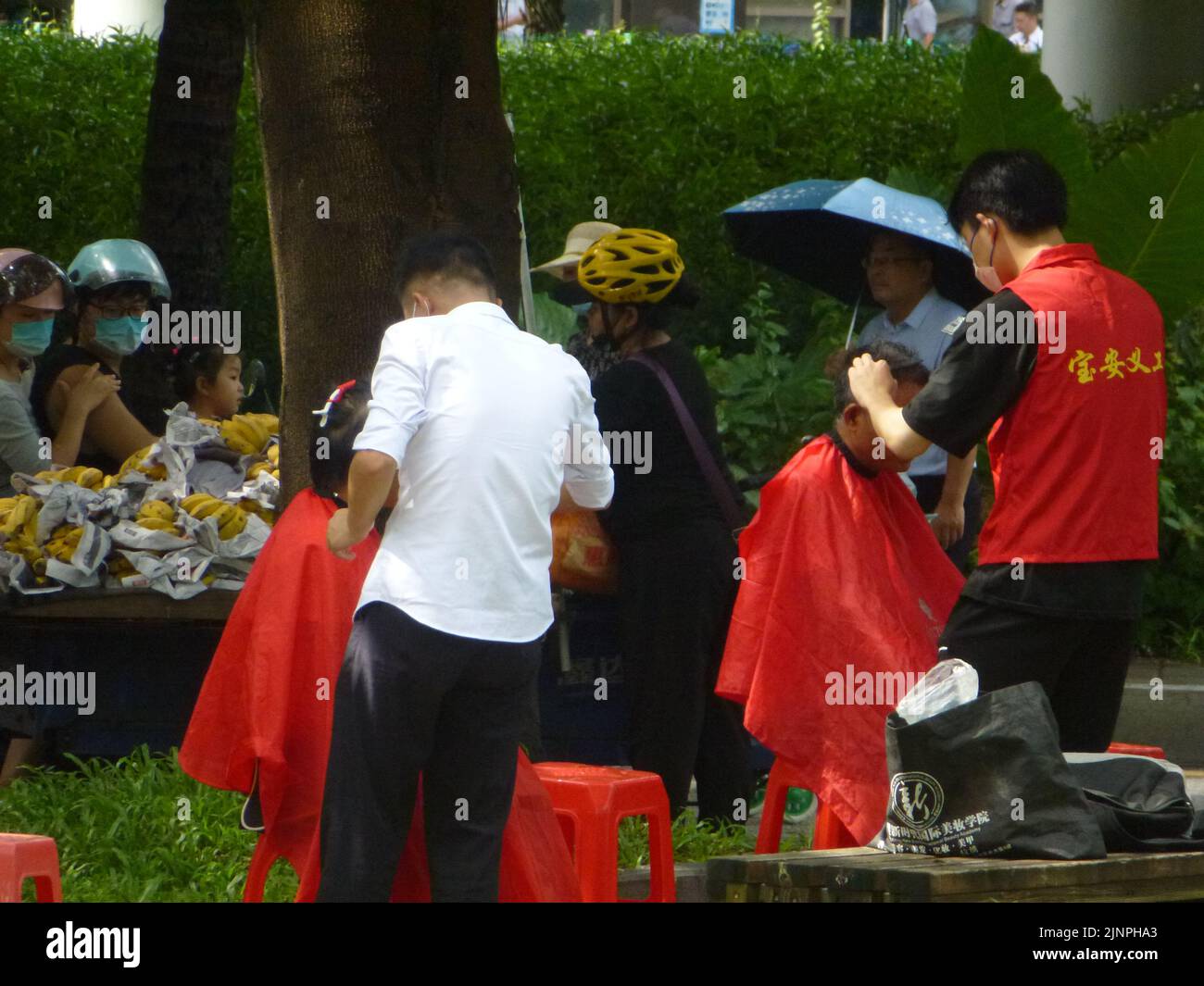 Shenzhen, China: roadside barber stalls charge cheap to attract people ...