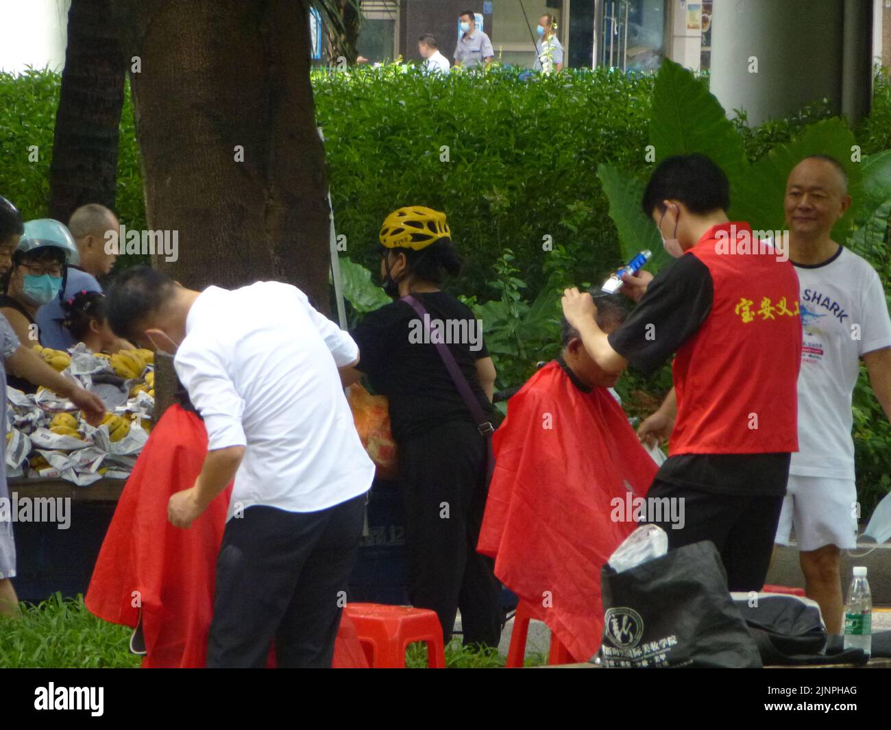 Shenzhen, China: roadside barber stalls charge cheap to attract people ...