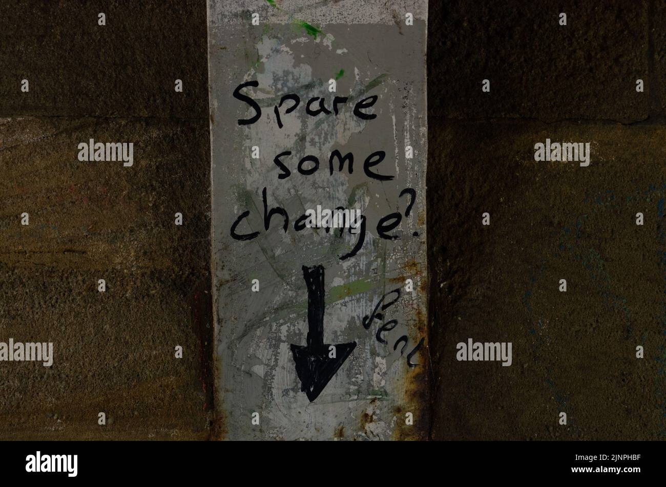 'Spare some change' written on a wall in York Stock Photo - Alamy