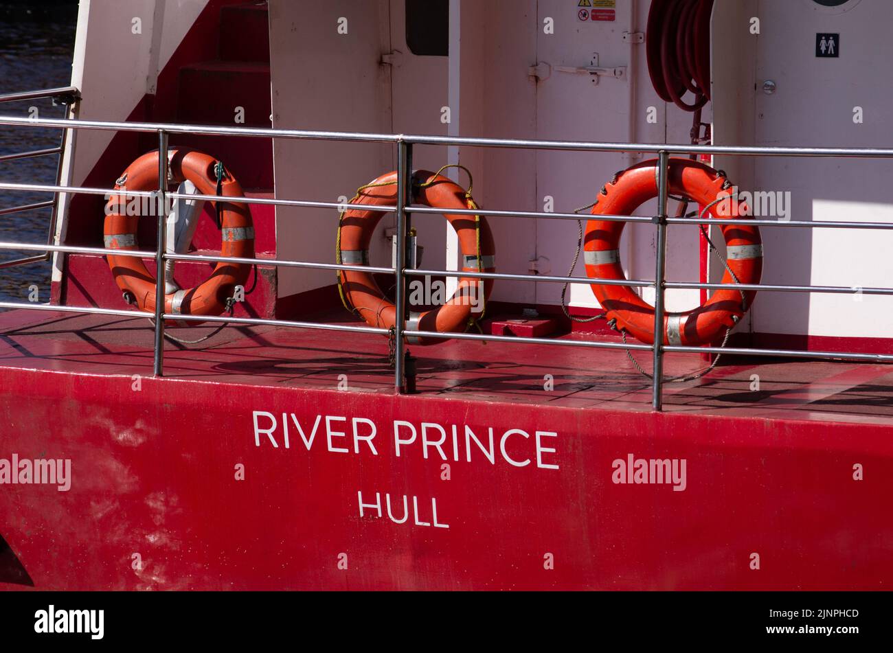 The back of the River Prince boat with lifebuoys hanging for the rail ...
