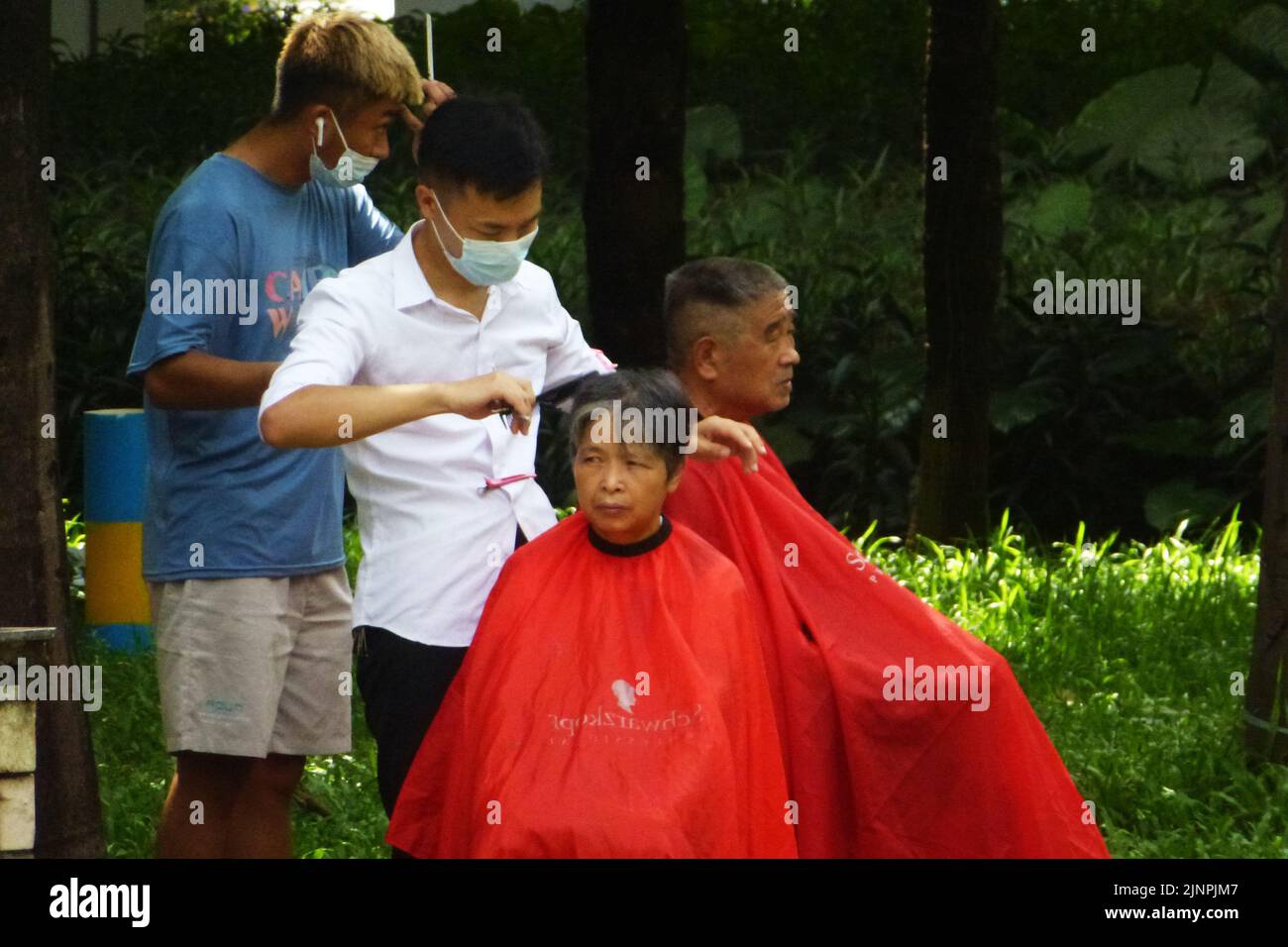 Shenzhen, China: roadside barber stalls charge cheap to attract people ...