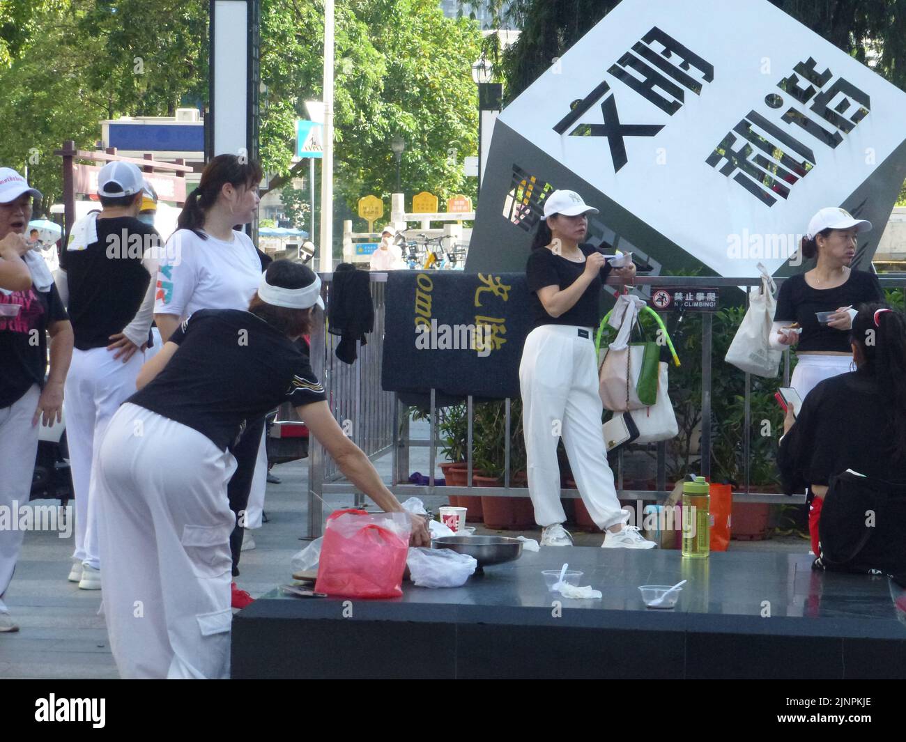 Shenzhen, China: the sight of women taking a break and drinking tea ...