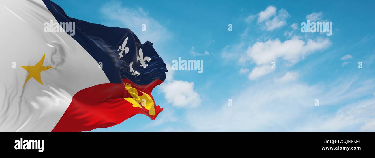 official flag of Acadiana untied states of America at cloudy sky ...