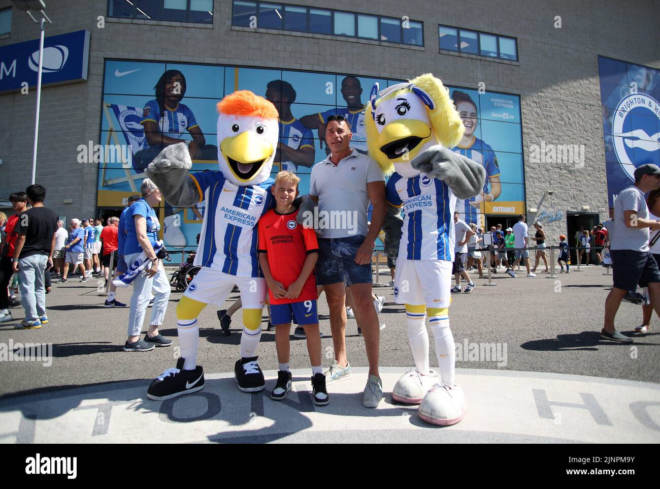 Brighton and Hove Albion fans pose with Mascots before Premier League ...