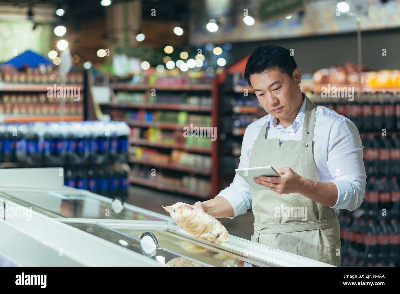 portrait of happy asian male shopkeeper with tablet Stock Photo - Alamy