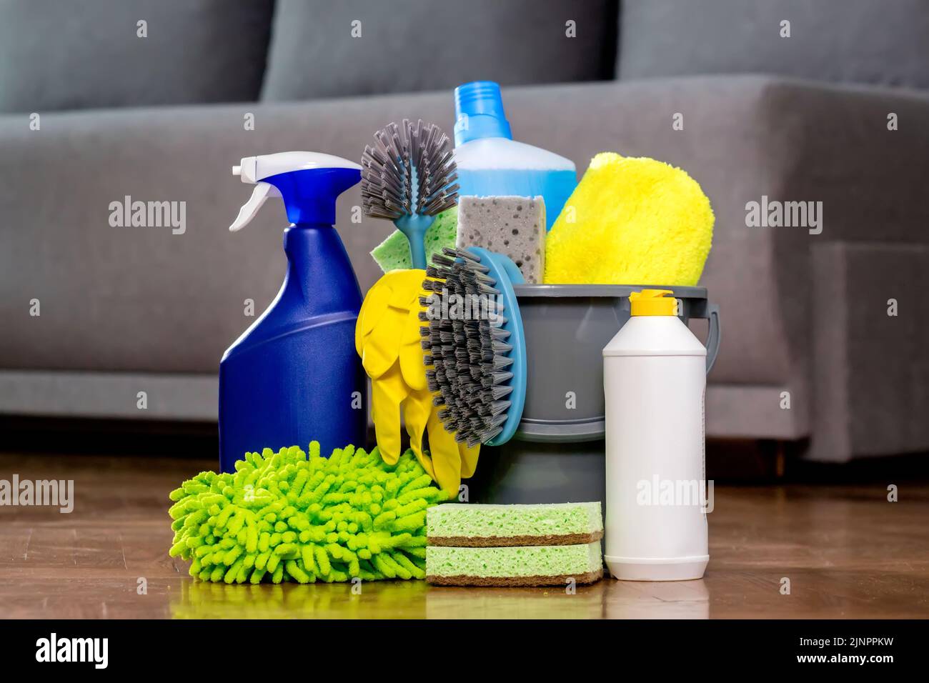 Bucket with cleaning items in the house, standing on the floor, on the ...