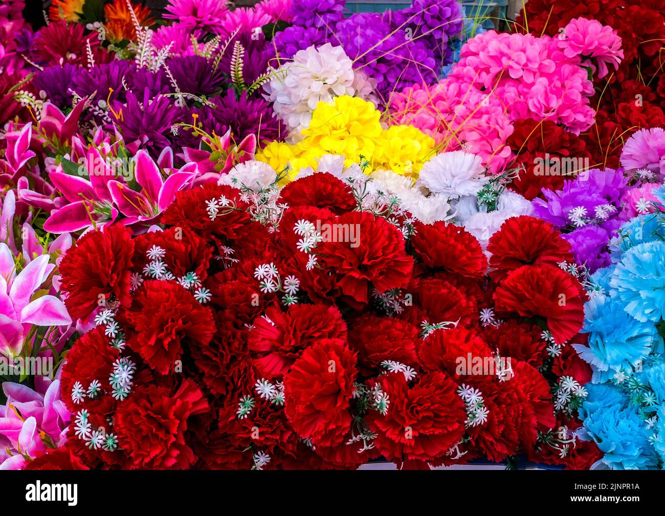 A colorful display of flowers on a florists stall in Ormskirk Market ...