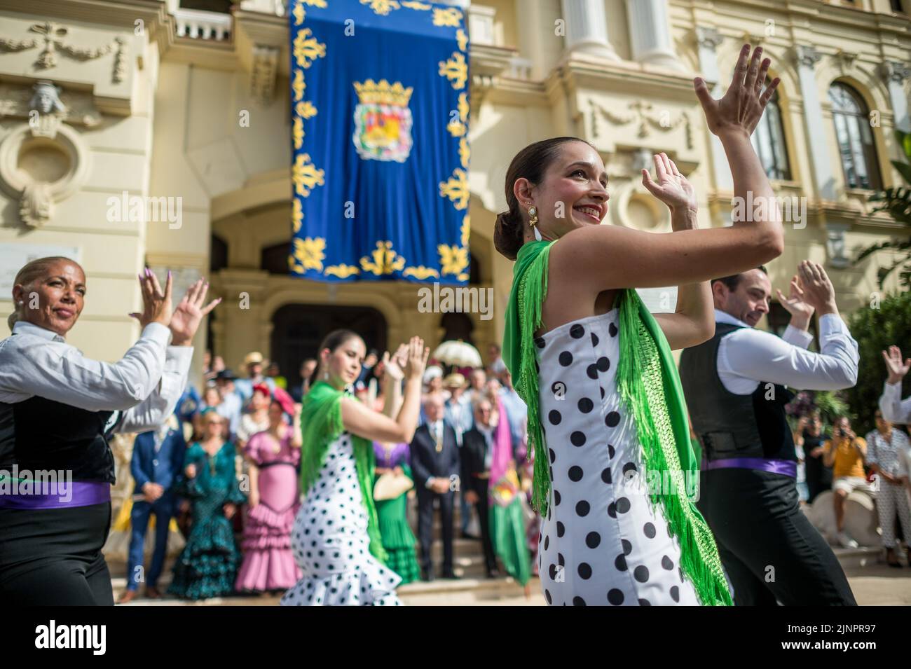 Malaga, Spain. 13th Aug, 2022. Women and men wearing flamenco and ...