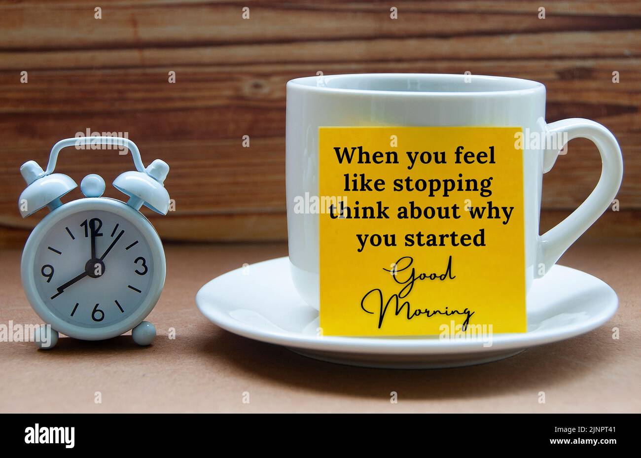 Motivational quote text on yellow notepad on coffee cup - When you feel ...
