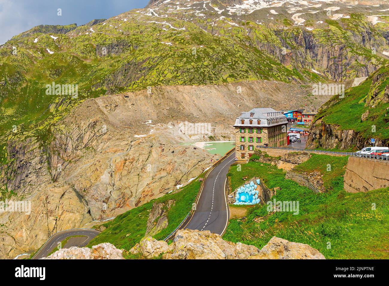 Furka pass in Swiss Alps in summer. A winding serpentine road winds ...