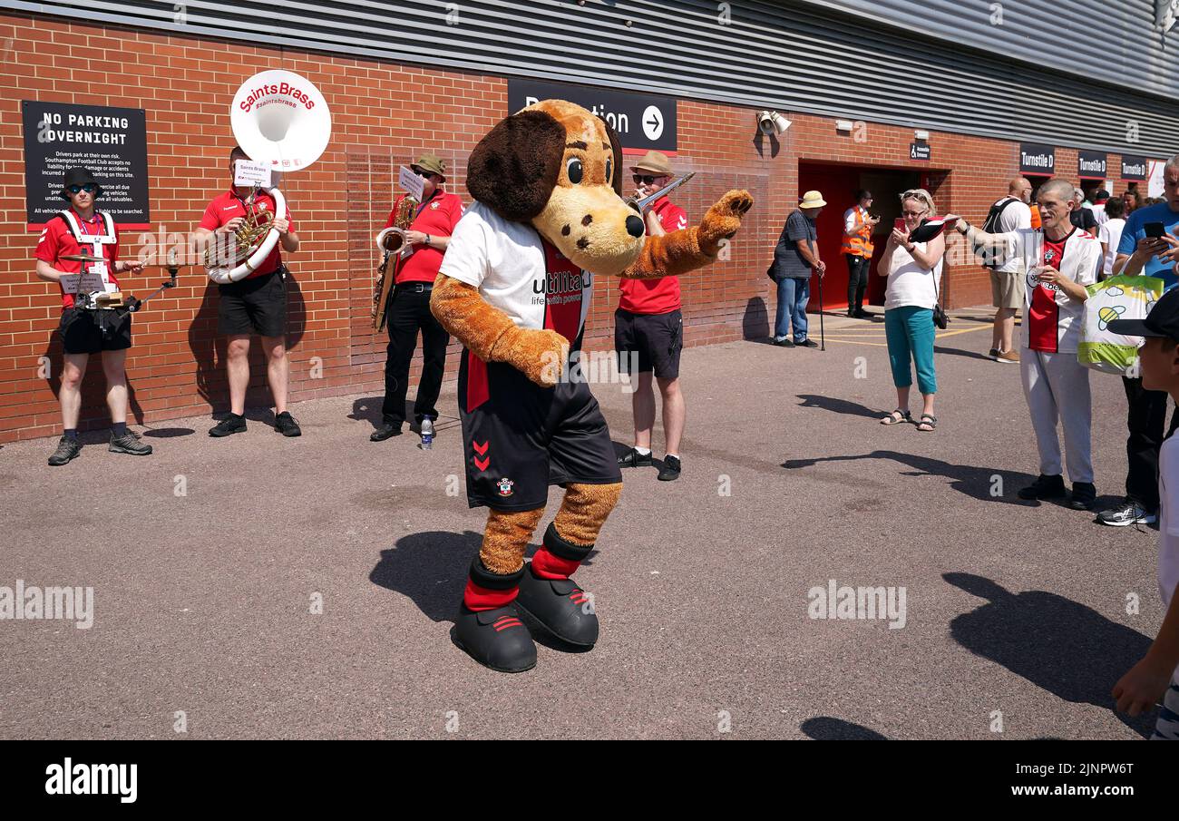 Southampton mascot Sammy Saint with fans outside the ground as he ...