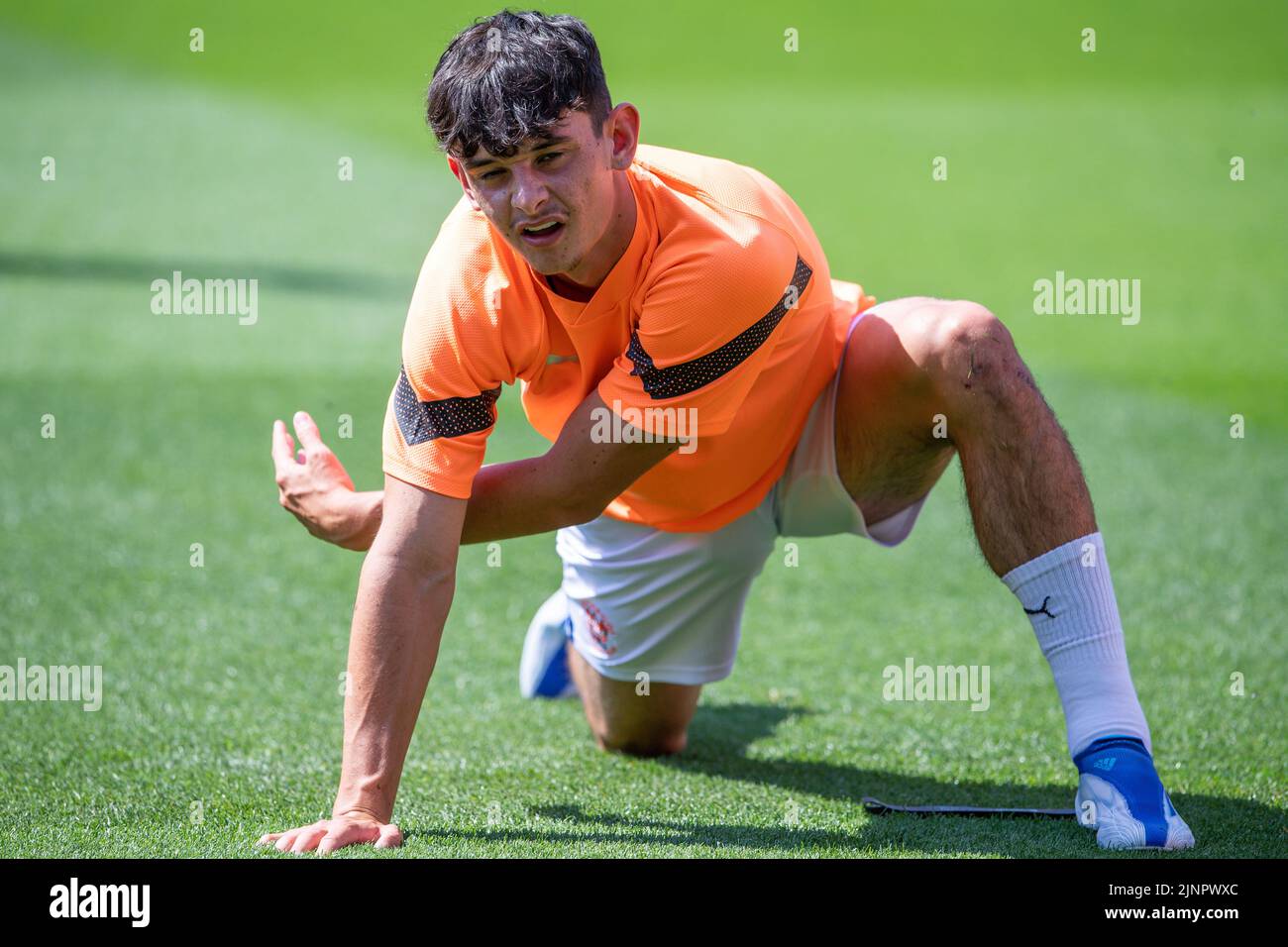 Charlie Patino #28 of Blackpool stretches during the pre-game warmup ...