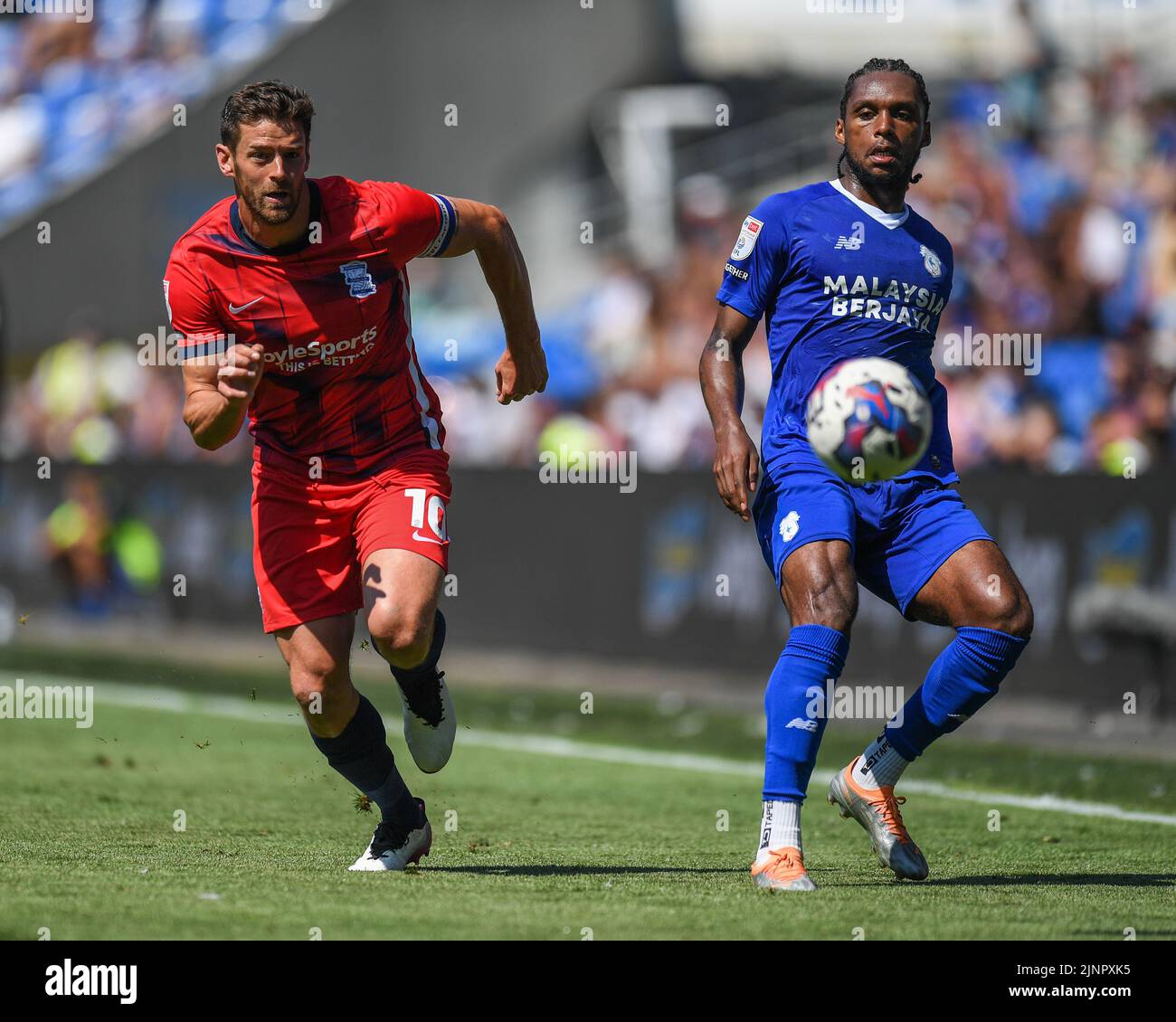 Mahlon Romeo #2 of Cardiff City Under pressure from Lukas Jutkiewicz ...