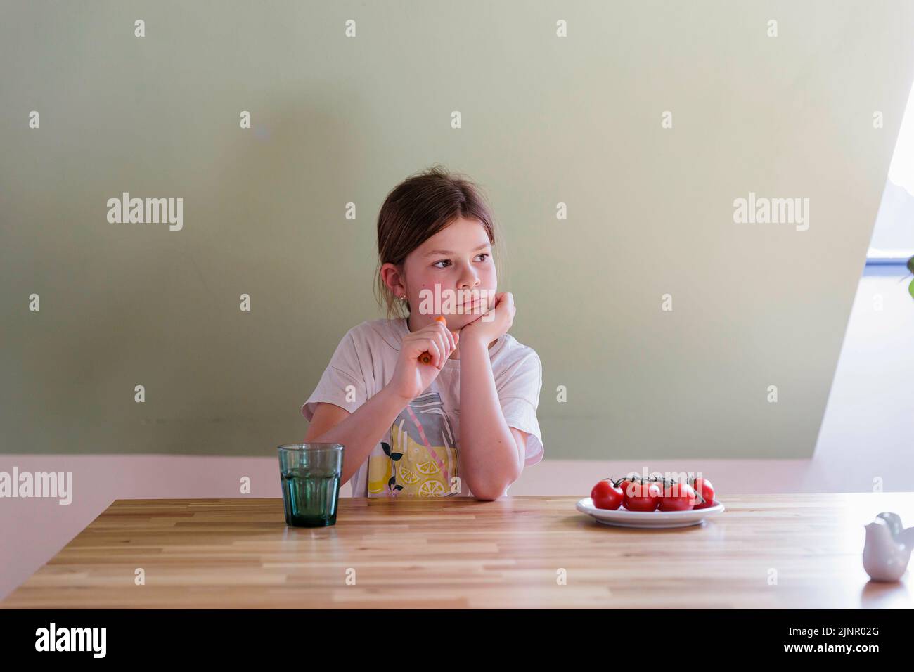 child sitting at the dining table || Model release available Stock ...