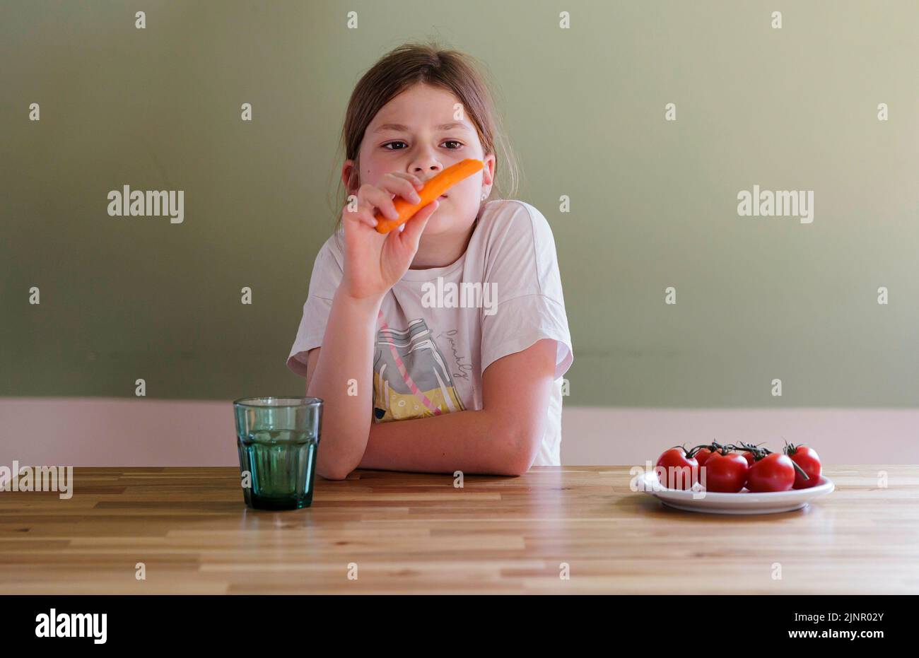 child sitting at the dining table || Model release available Stock ...