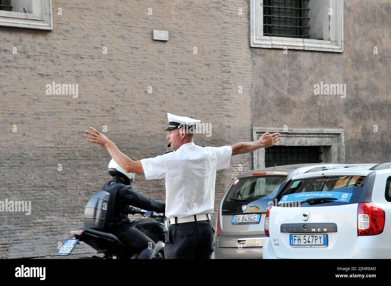 Rome / Italy 18.July 2019/ Police officer instructing rod traffic choas ...
