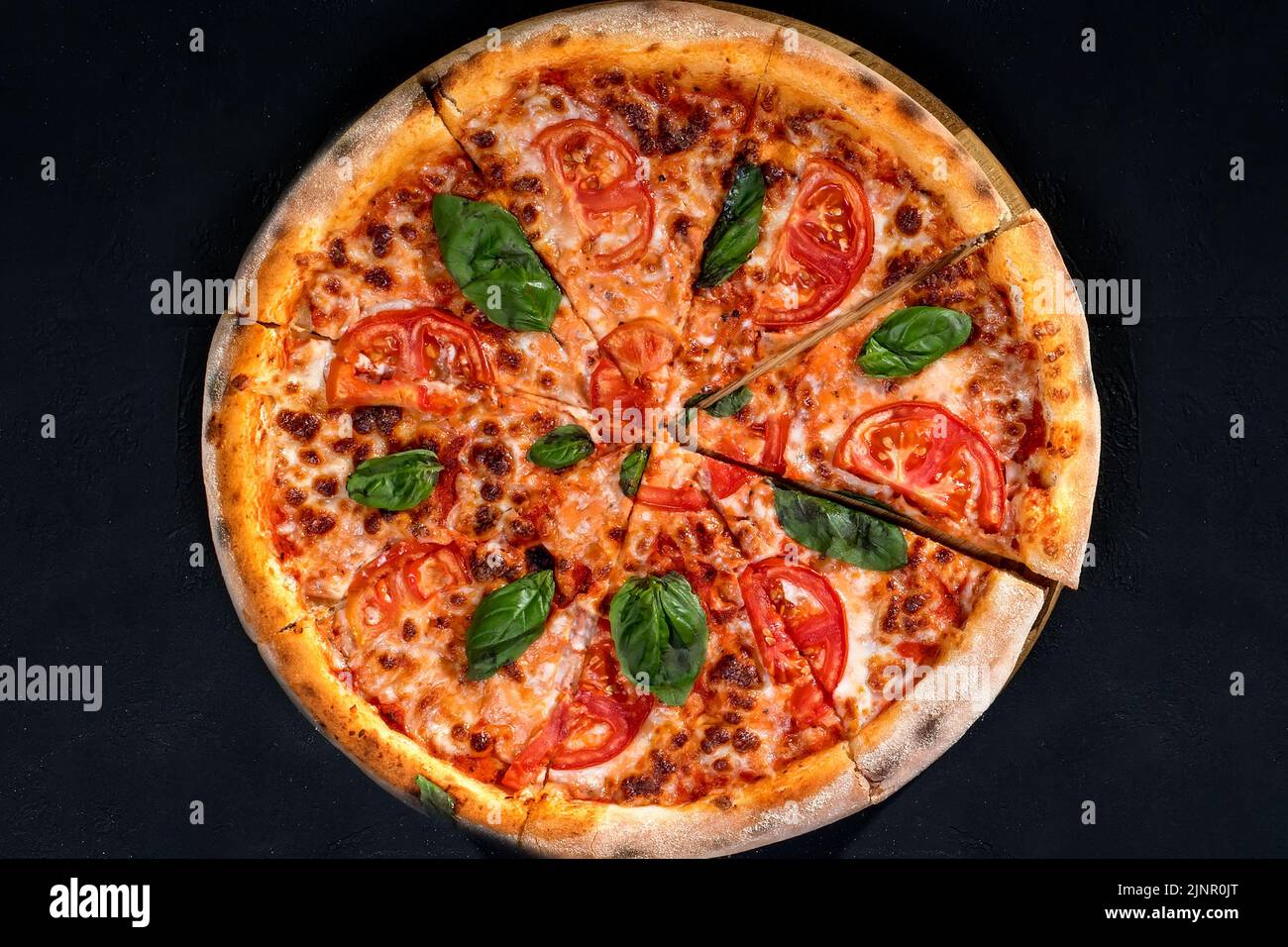 Delicious fragrant pizza with mozzarella, tomatoes and basil with tomato sauce - Margherita ...