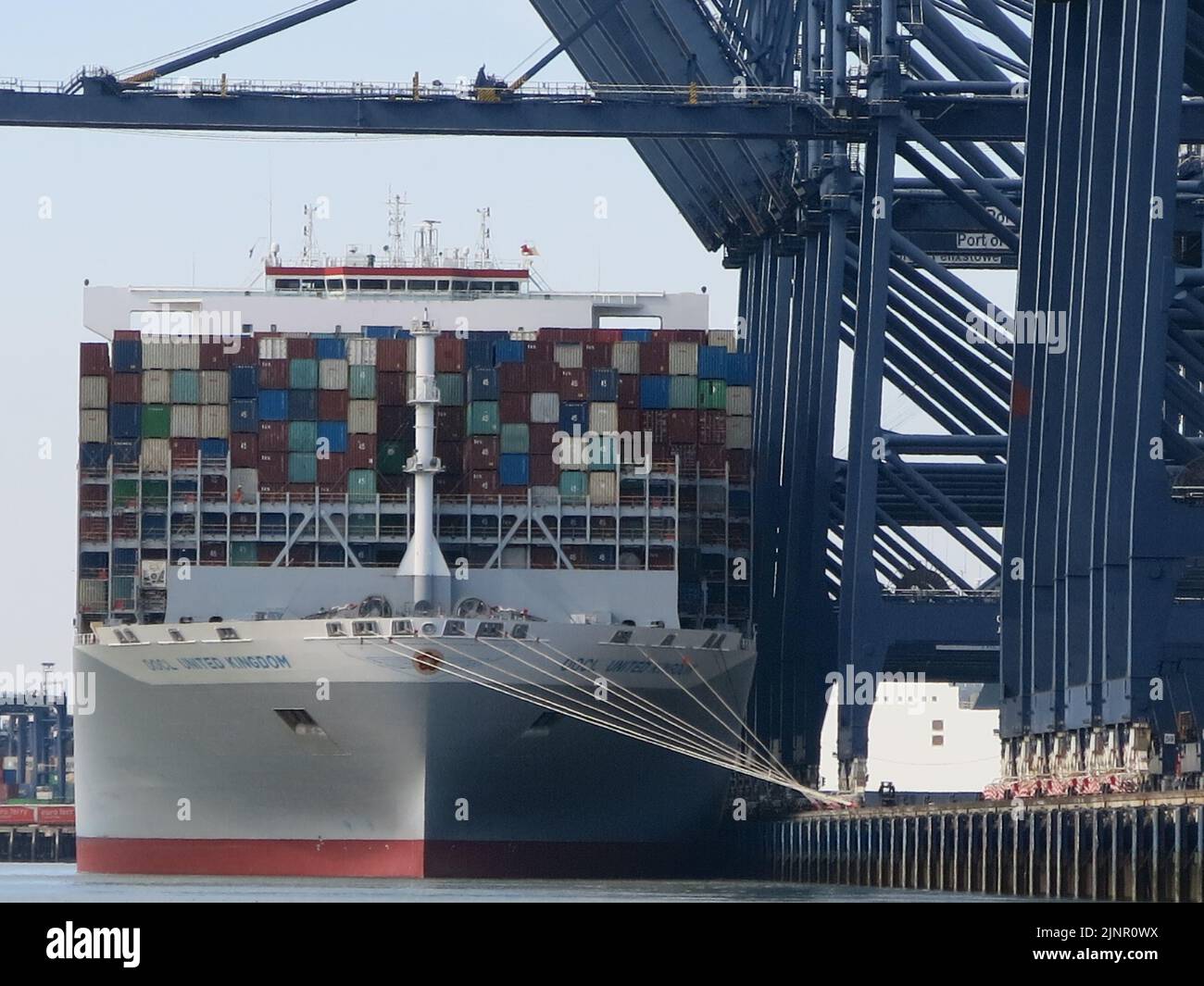 One of the large ocean-going OOCL UK vessels laden with shipping ...